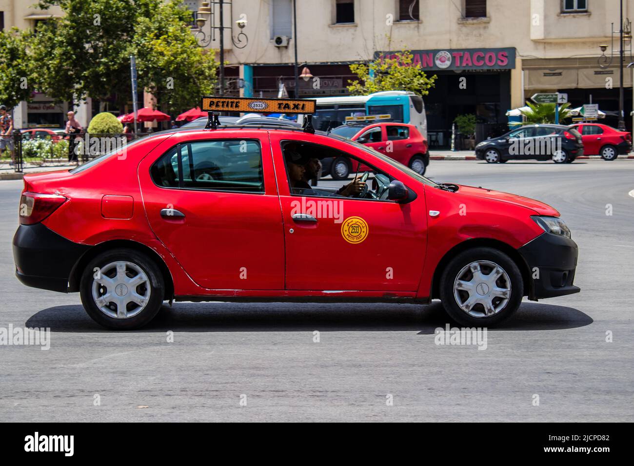 Fez, Morocco - June 14, 2022 Taxi driving through the streets of Fez ...