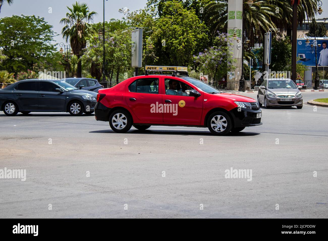 Fez, Morocco - June 14, 2022 Taxi driving through the streets of Fez ...