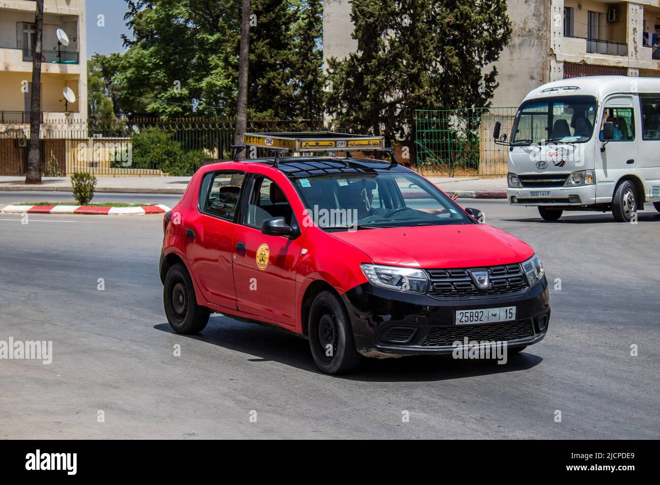 Fez, Morocco - June 14, 2022 Taxi driving through the streets of Fez ...