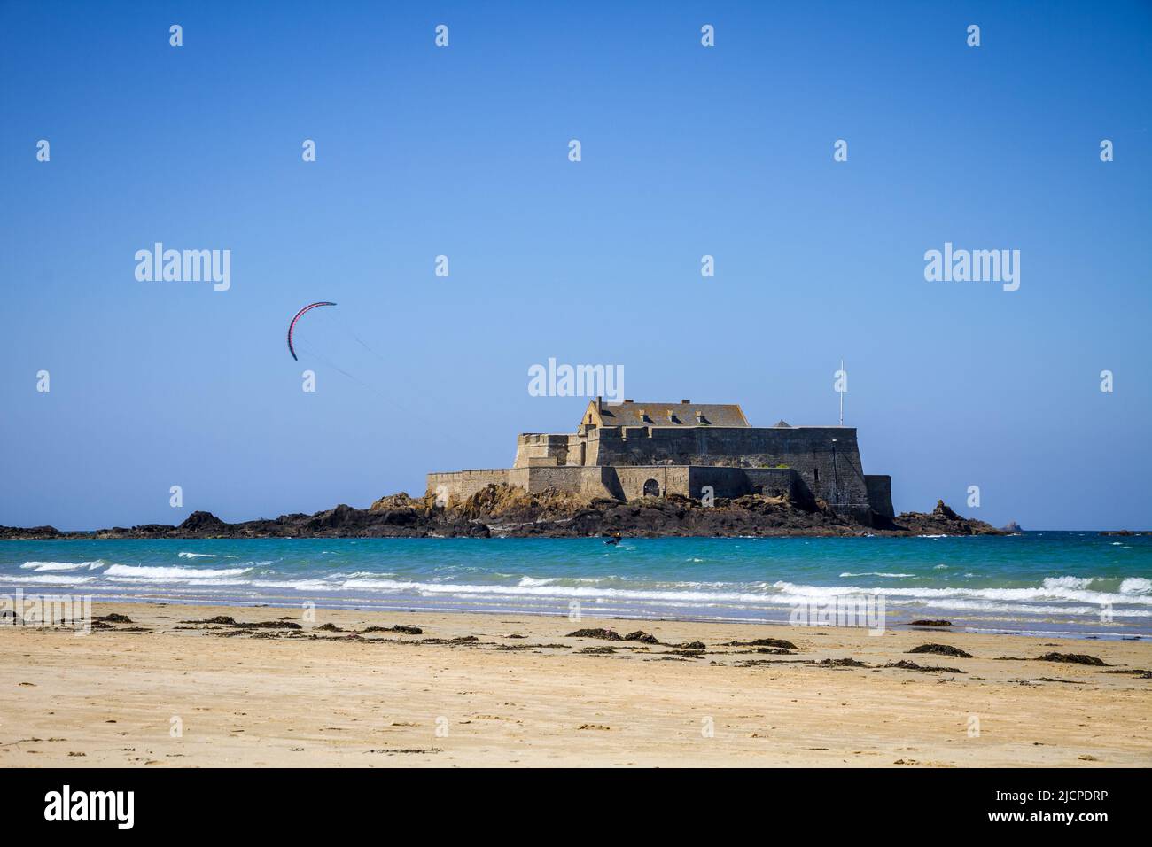 Fort National island and a kite surfer on sea in Saint-Malo city ...