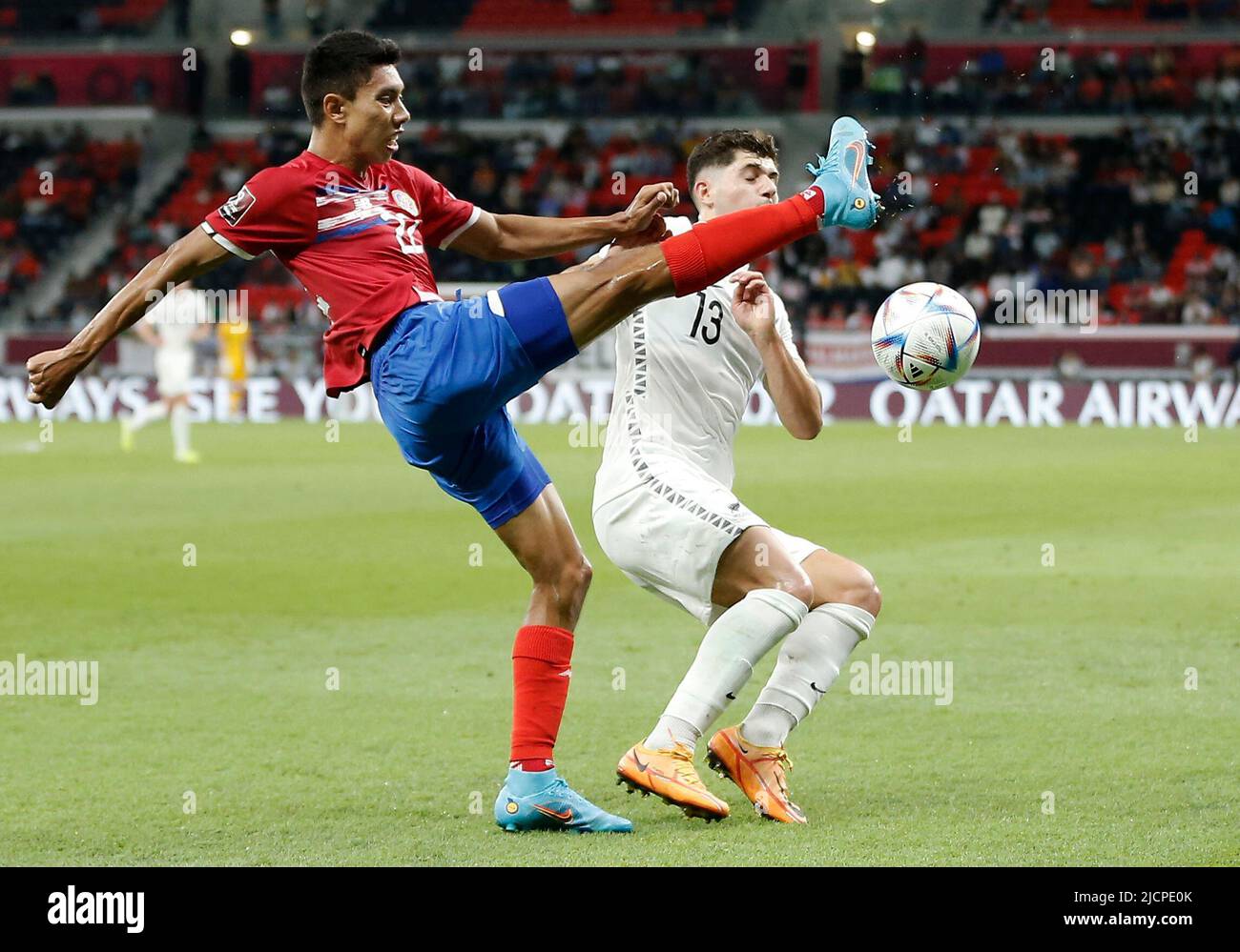 Doha, Qatar. 14th June, 2022. Carlos Marinez (L) of Costa Rica vies ...