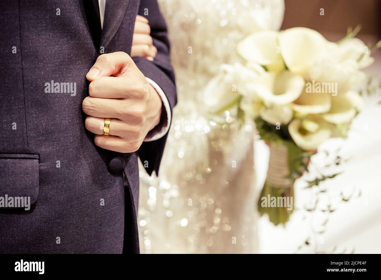 A close-up image of wedding ring of groom in wedding venue Stock Photo ...