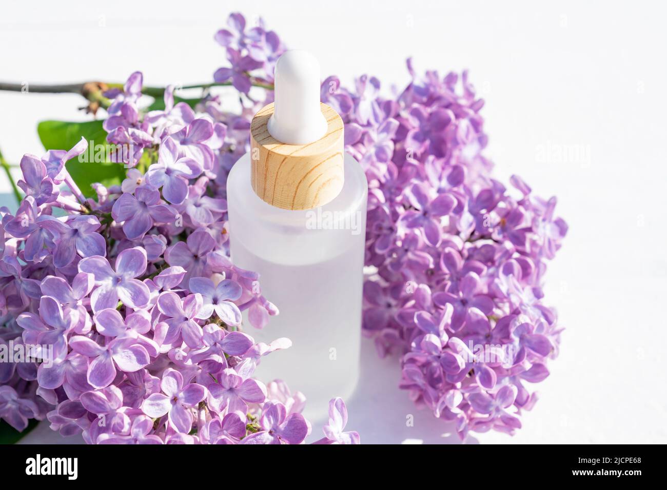 Serum or Liquid Collagen essence in frosted glass bottle on white ...