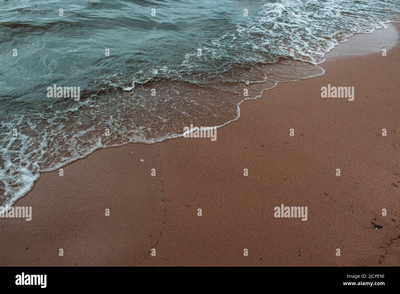 Waves crashing on the beach Stock Photo - Alamy