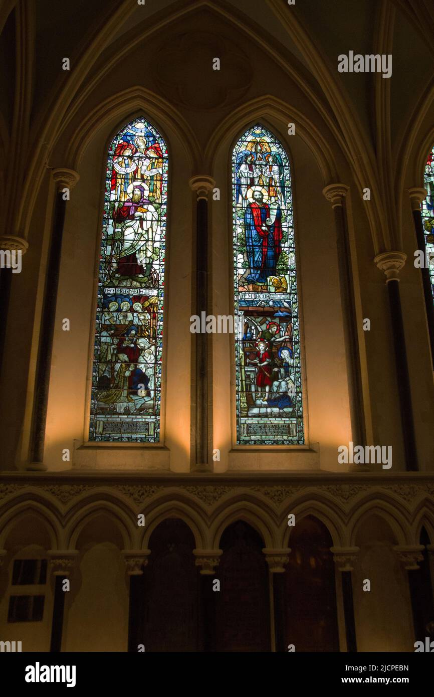 Light through stained glass rosettes, representing religious images ...