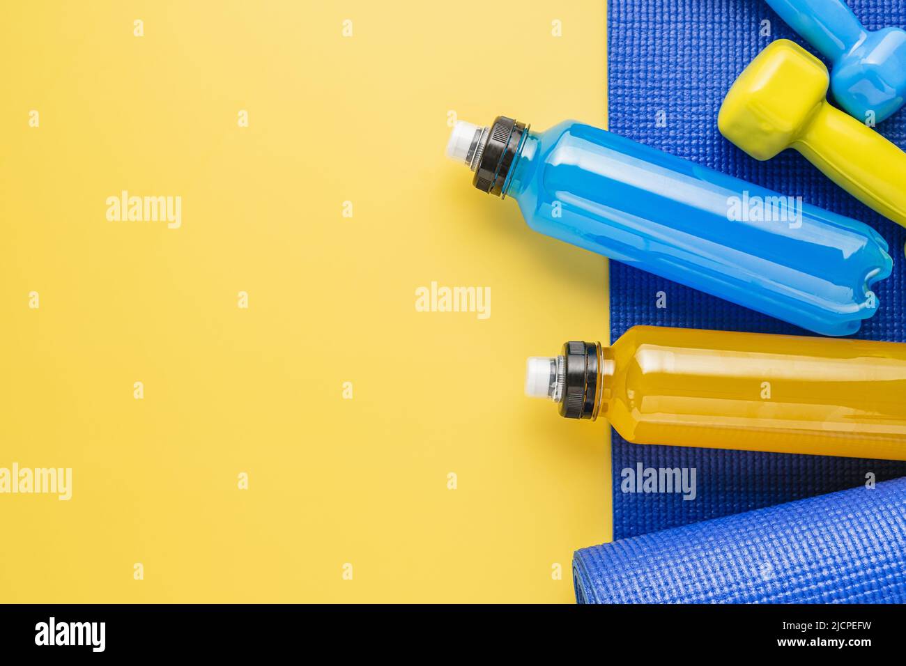 Isotonic energy drink. Bottle with blue and yellow transparent ...