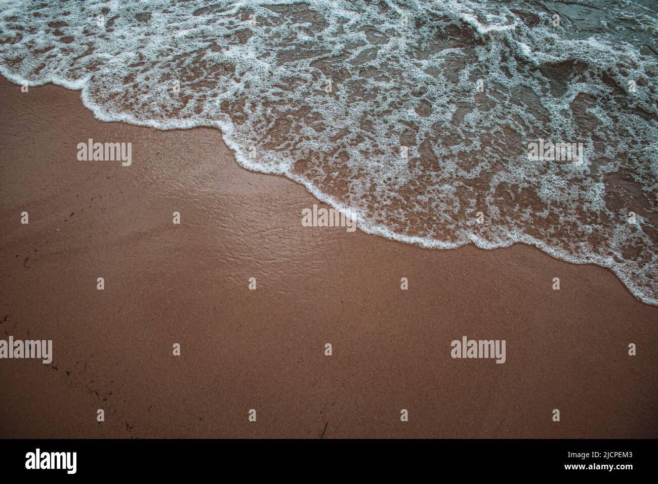 Wave washing onto beach hi-res stock photography and images - Alamy