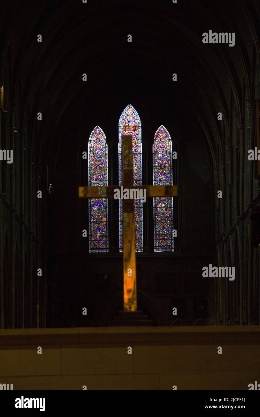 Light through stained glass rosettes, representing religious images ...