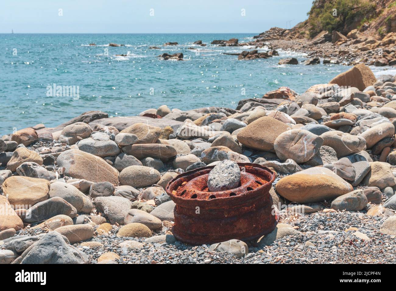 High angle view of an abandoned rim on a beach. Concept of ...