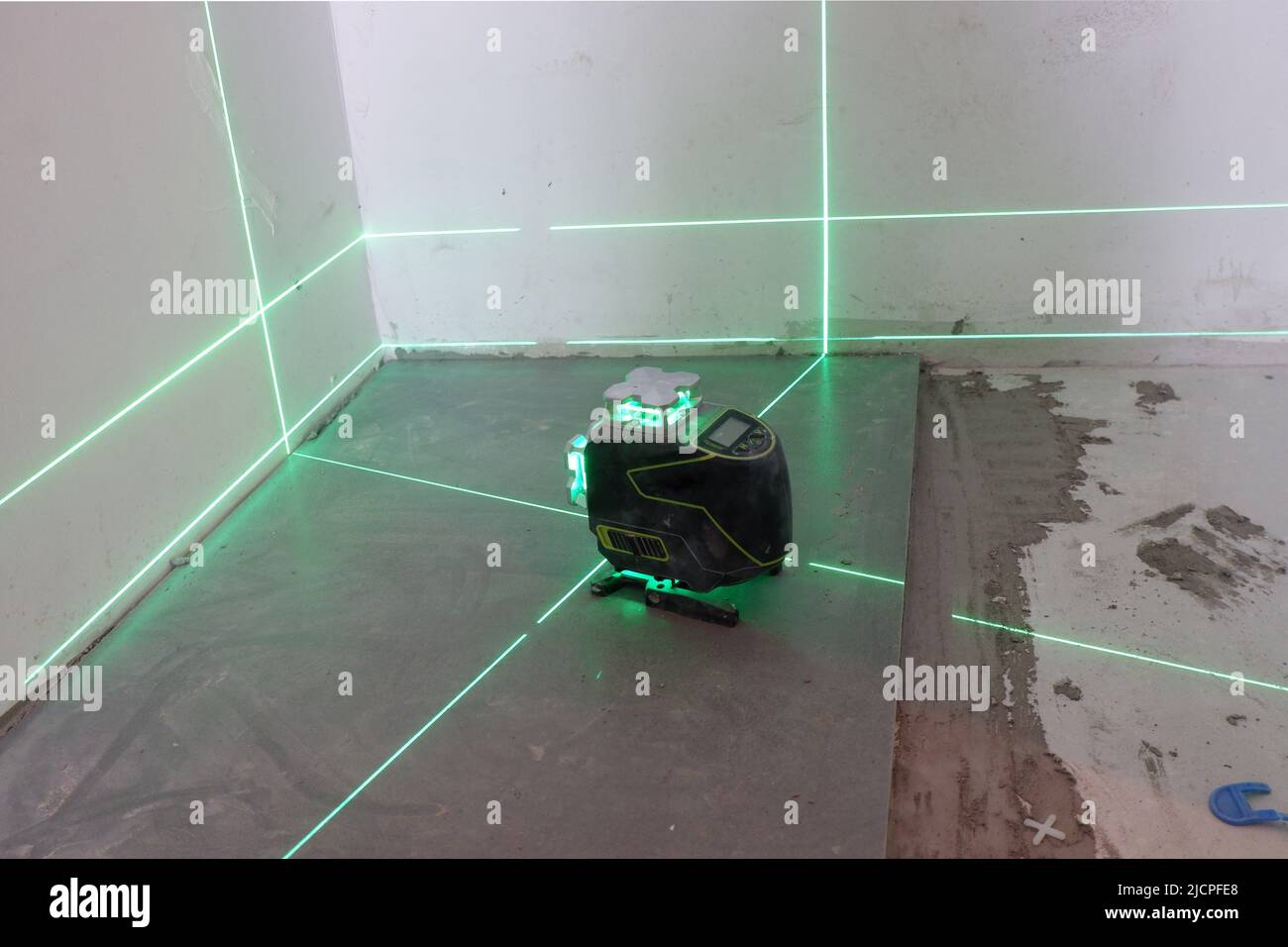 the laser level marks the lines for marking on the construction site ...