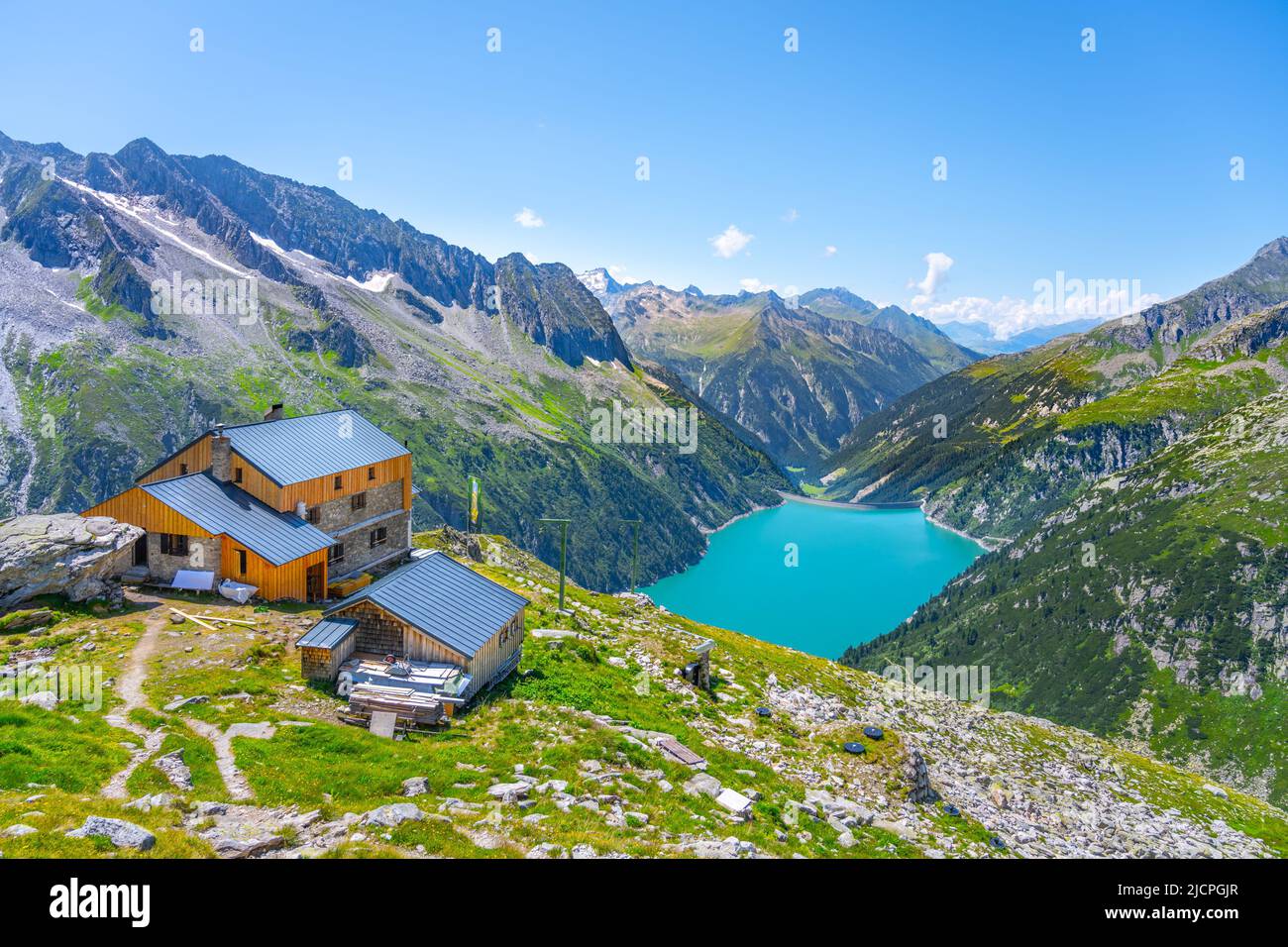 Alpine valley and mountain hut Stock Photo - Alamy