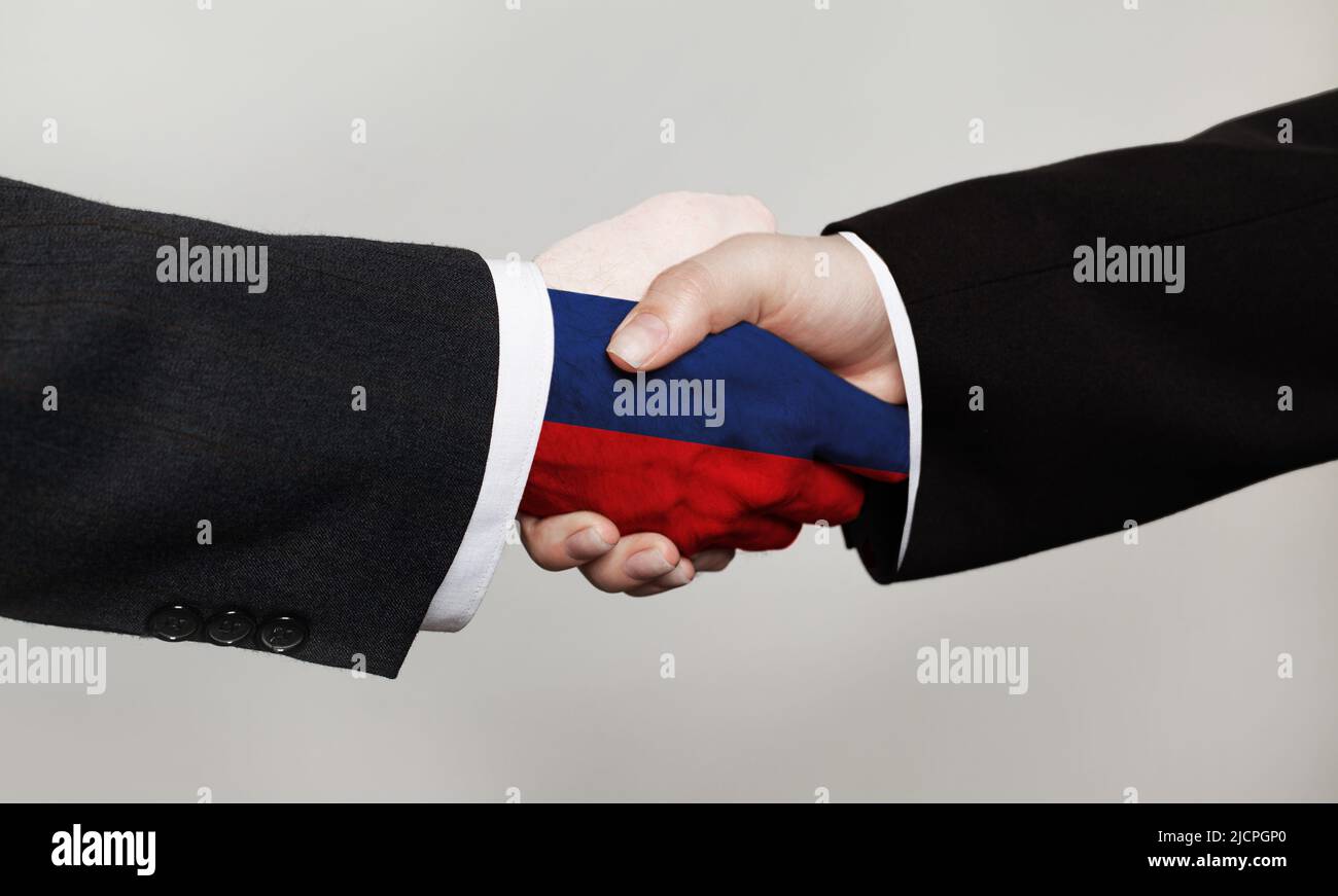 Russia cooperation and business with handshake on white background ...