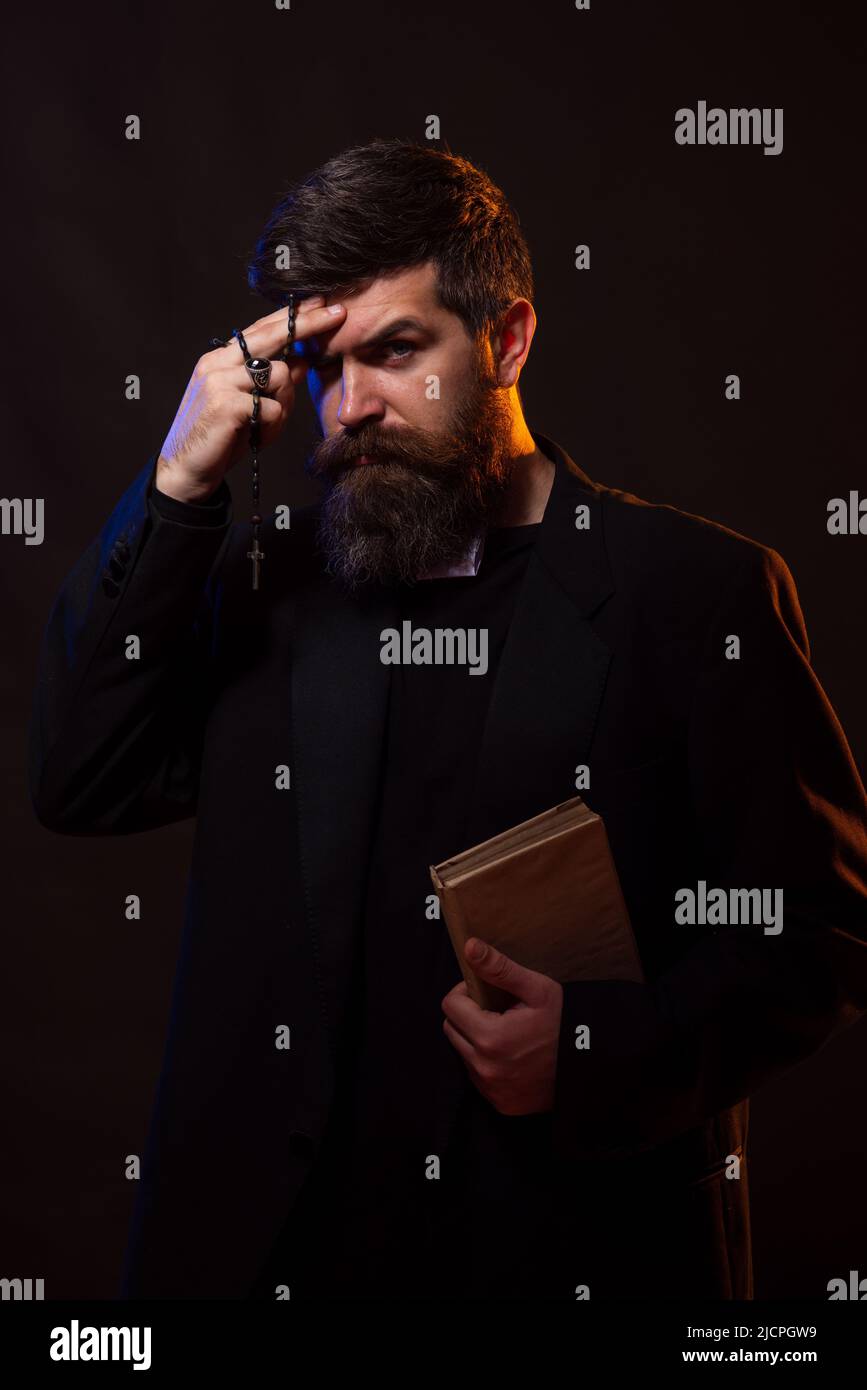 Pastor or preacher with the Bible. Praying hands priest portrait of ...