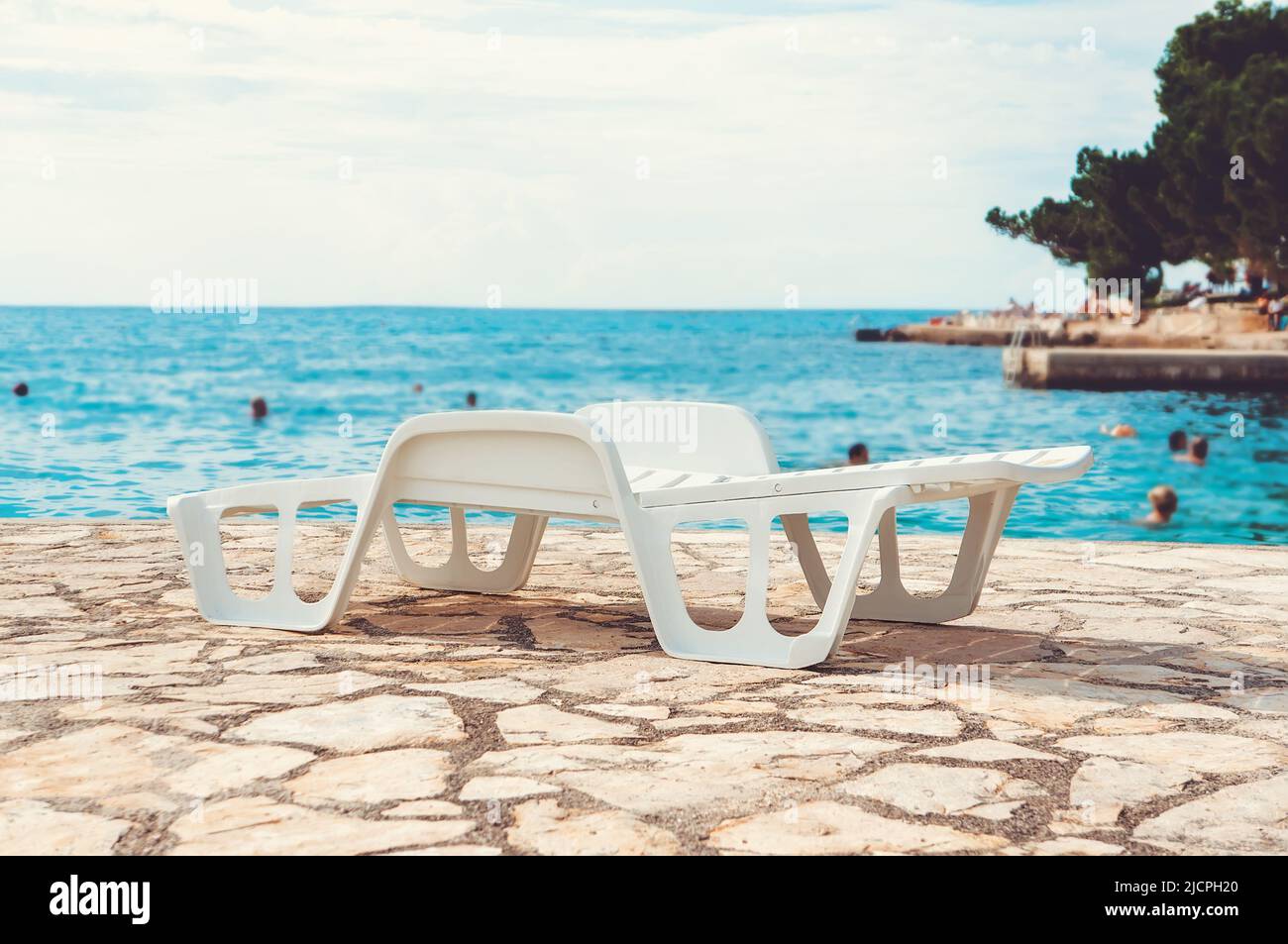 Sun loungers on the beach in Europe. Sunny beaches of Croatia Stock ...