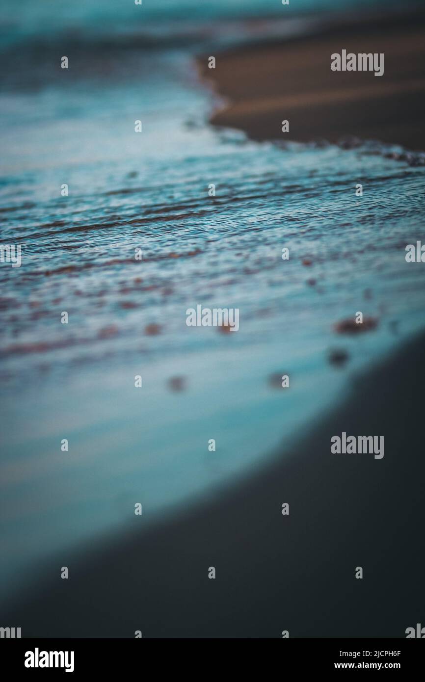 Wave washing onto beach hi-res stock photography and images - Alamy