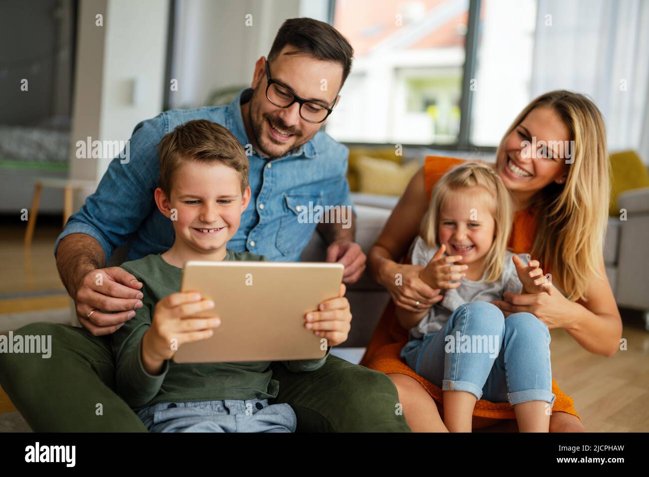 Device technology family online education concept. Happy family with ...
