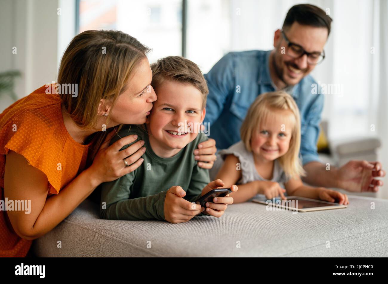 Device technology family online education concept. Happy family with ...