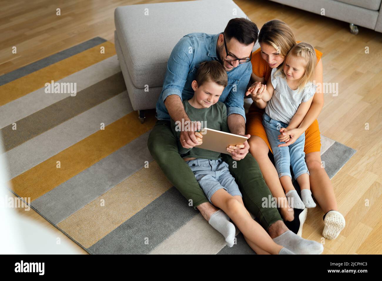 Device technology family online education concept. Happy family with ...