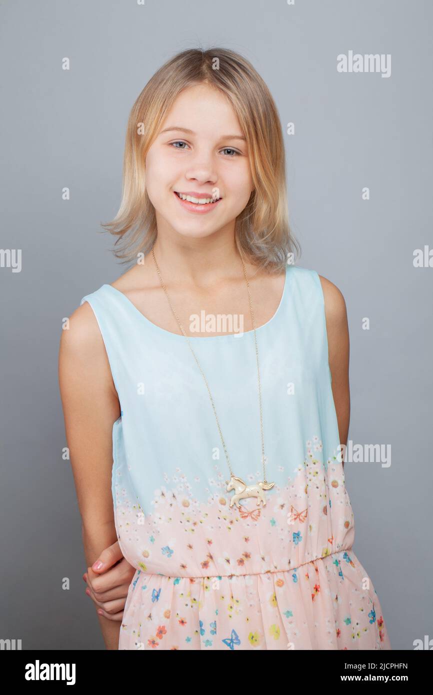 Attractive little girl studio portrait Stock Photo - Alamy