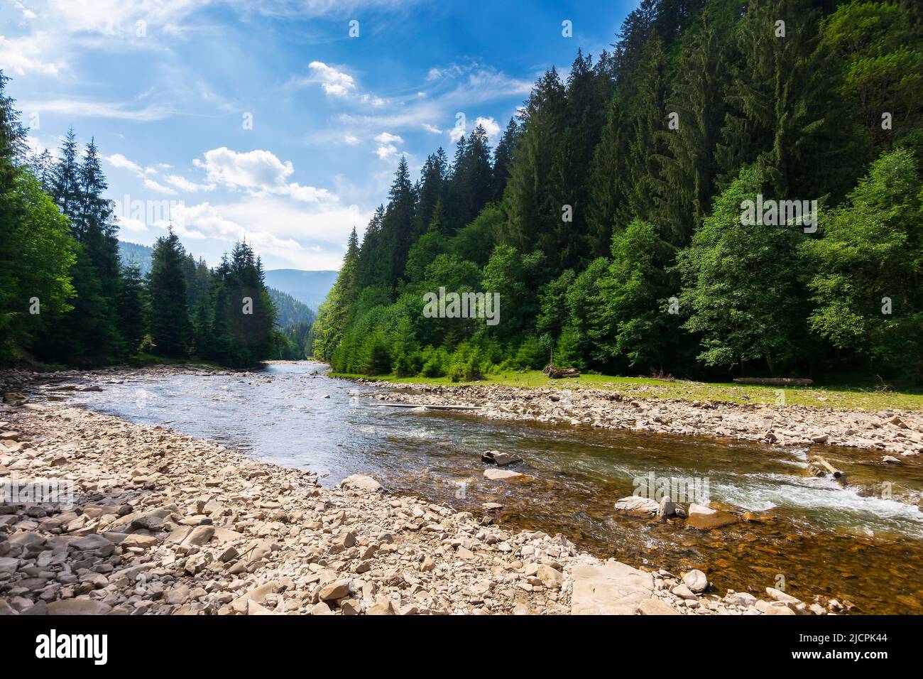 landscape with river running through valley. mountainous countryside ...