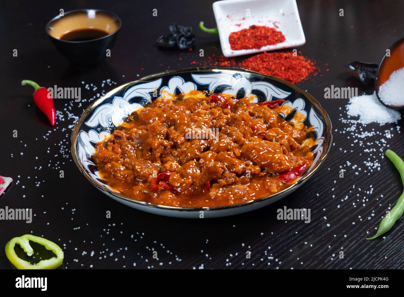 Asian food. Beef in spicy sauce with sesame seeds and chili pepper ...