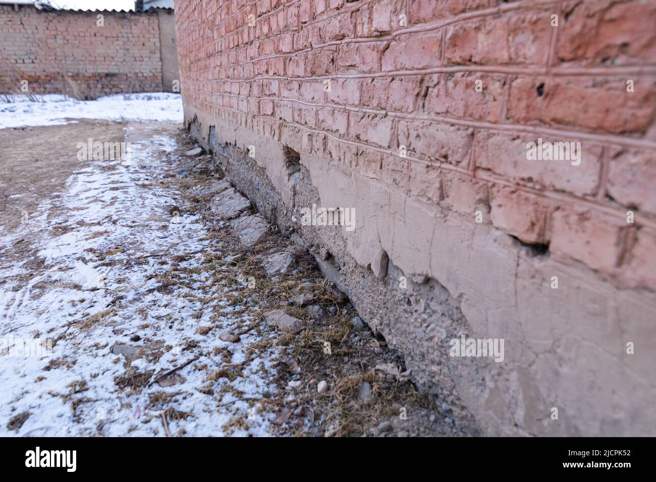 The crumbling foundation of the house Stock Photo - Alamy