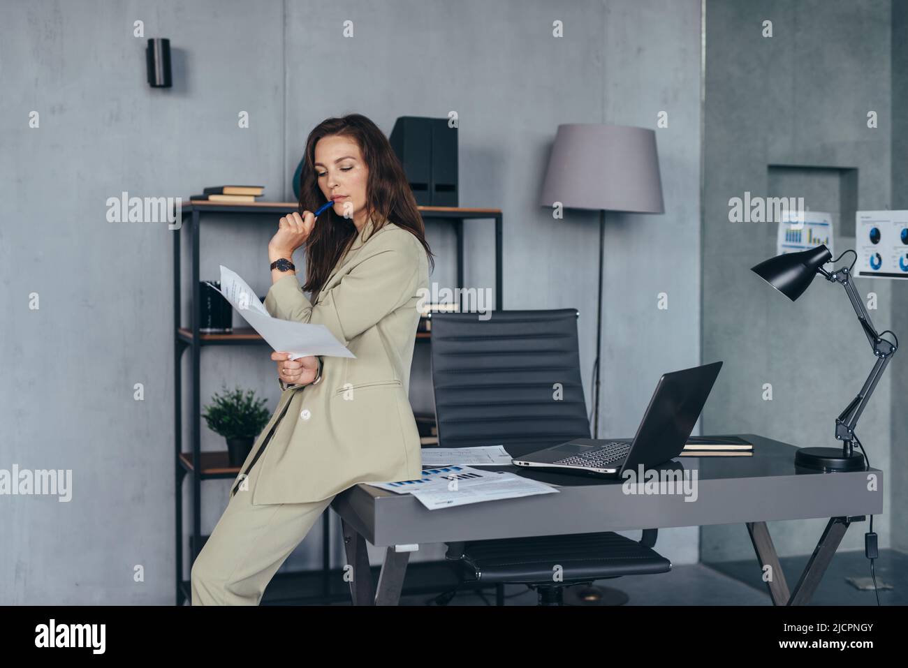 Woman working desk looks hi-res stock photography and images - Alamy