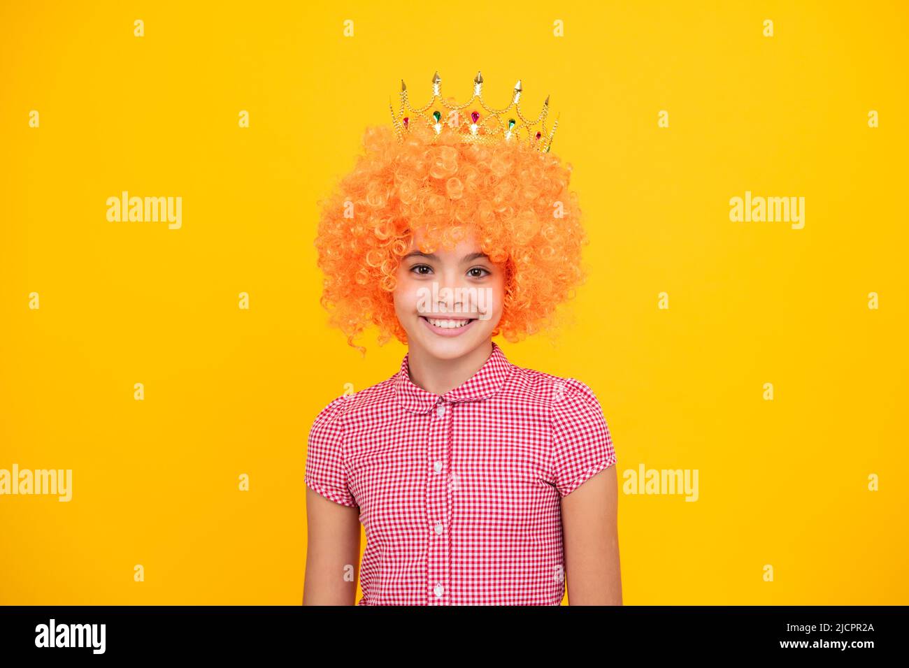 Little queen in wig wearing golden crown. Teenage girl princess holding ...