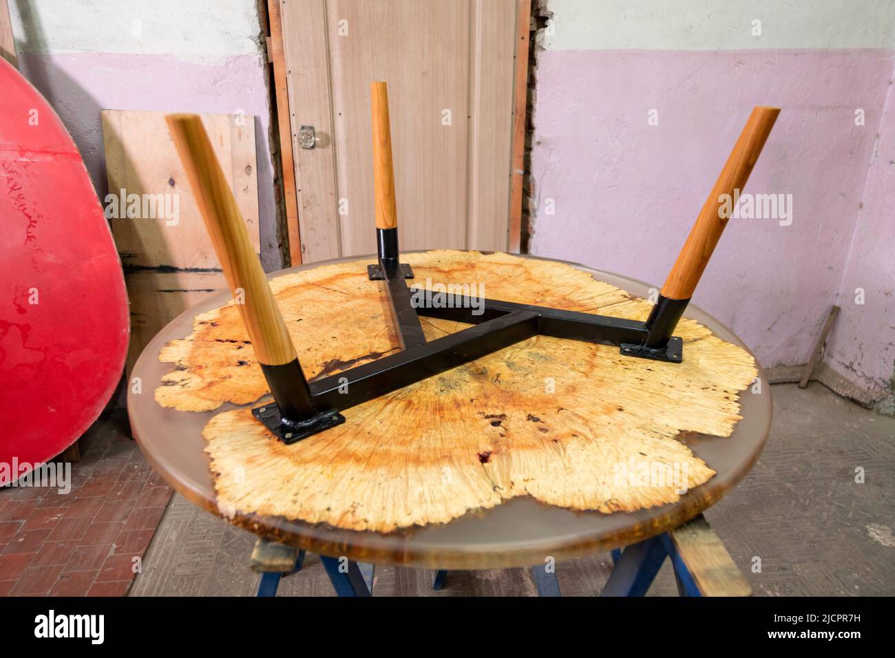 Epoxy resin round table in workshop Stock Photo - Alamy