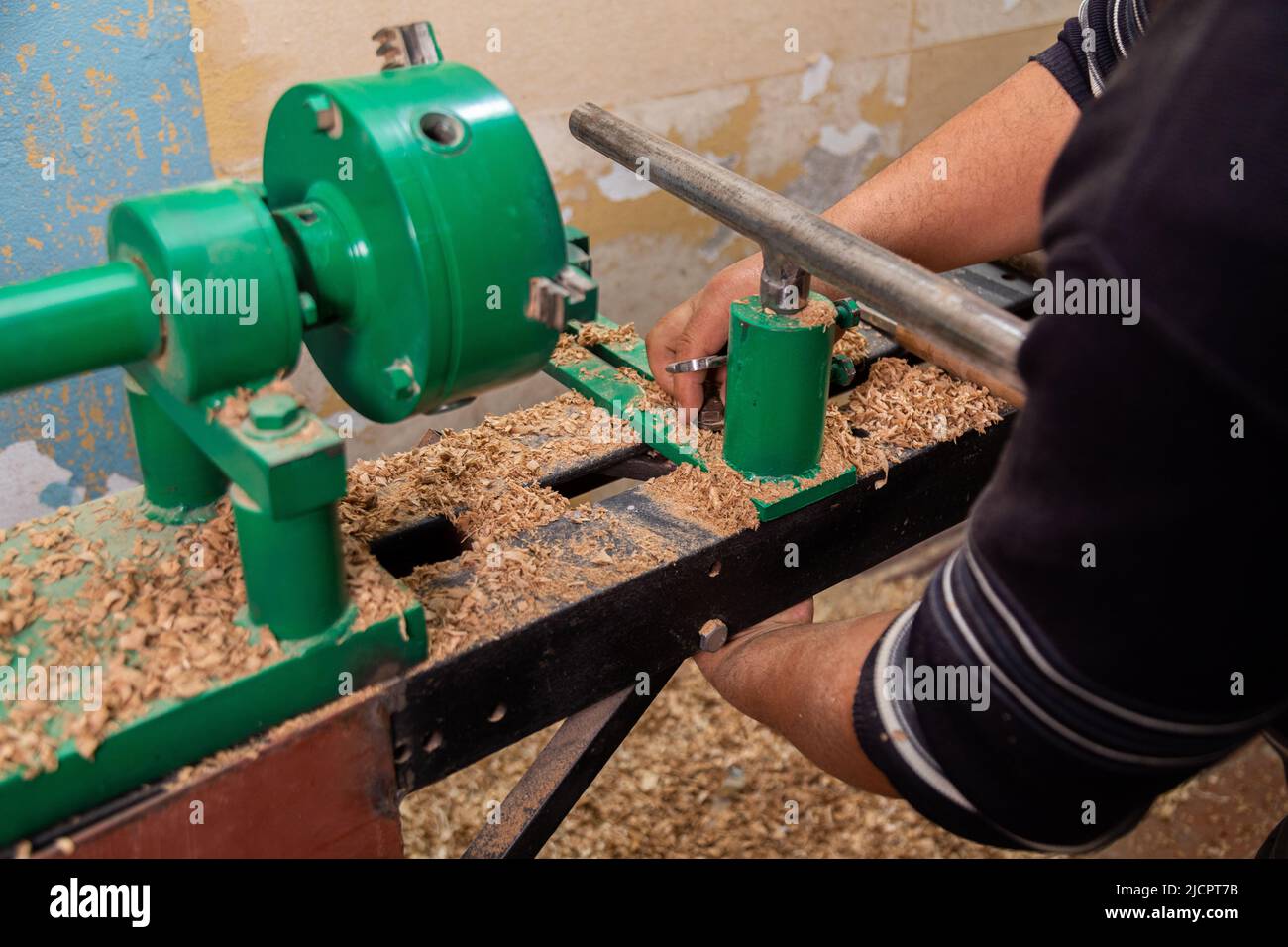 Carpenter preparing machine for turning wood on a lathe Stock Photo - Alamy