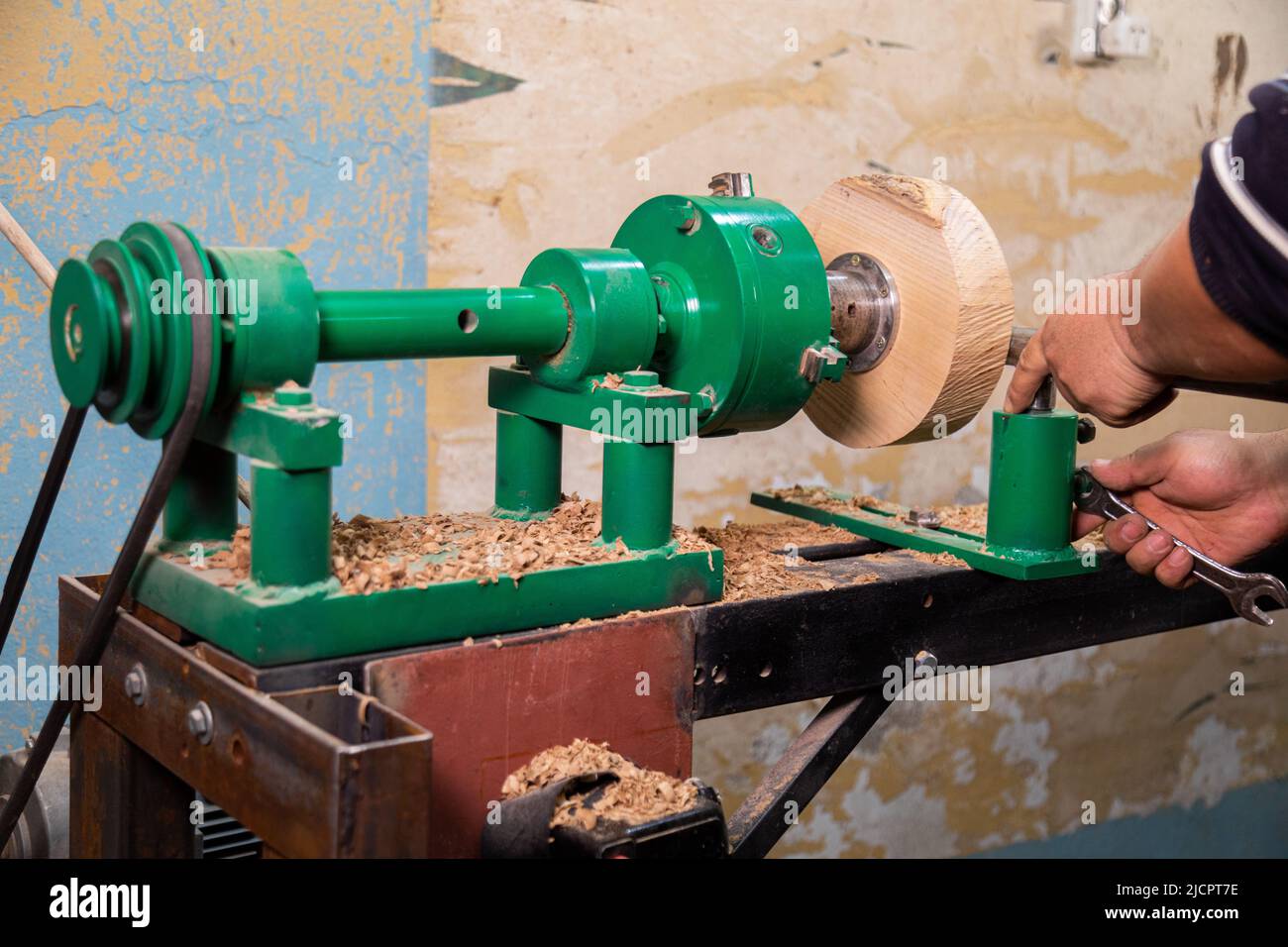 Carpenter preparing machine for turning wood on a lathe Stock Photo - Alamy