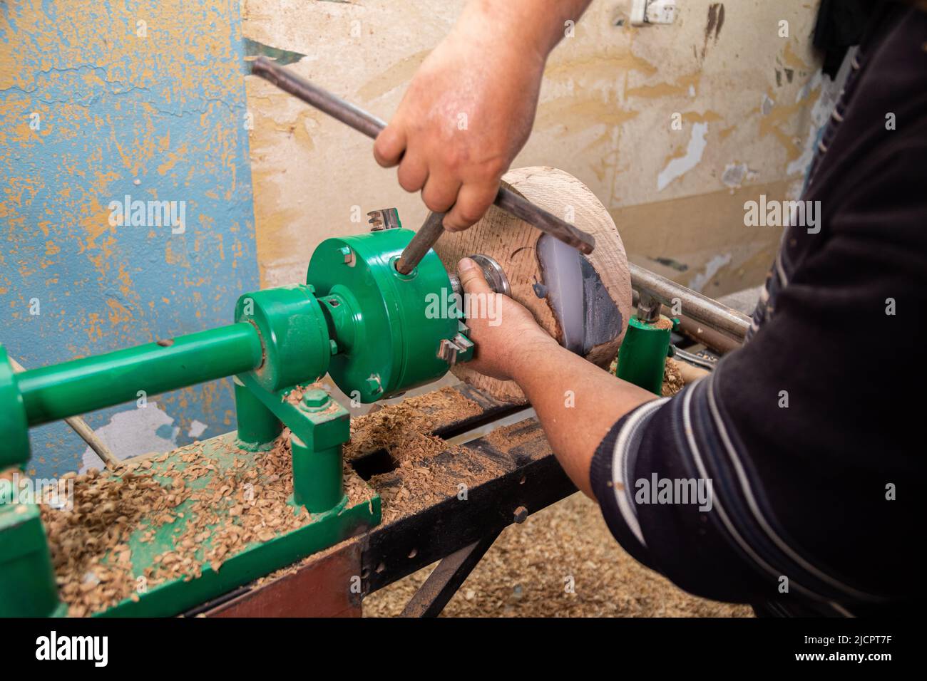 Carpenter preparing machine for turning wood on a lathe Stock Photo - Alamy