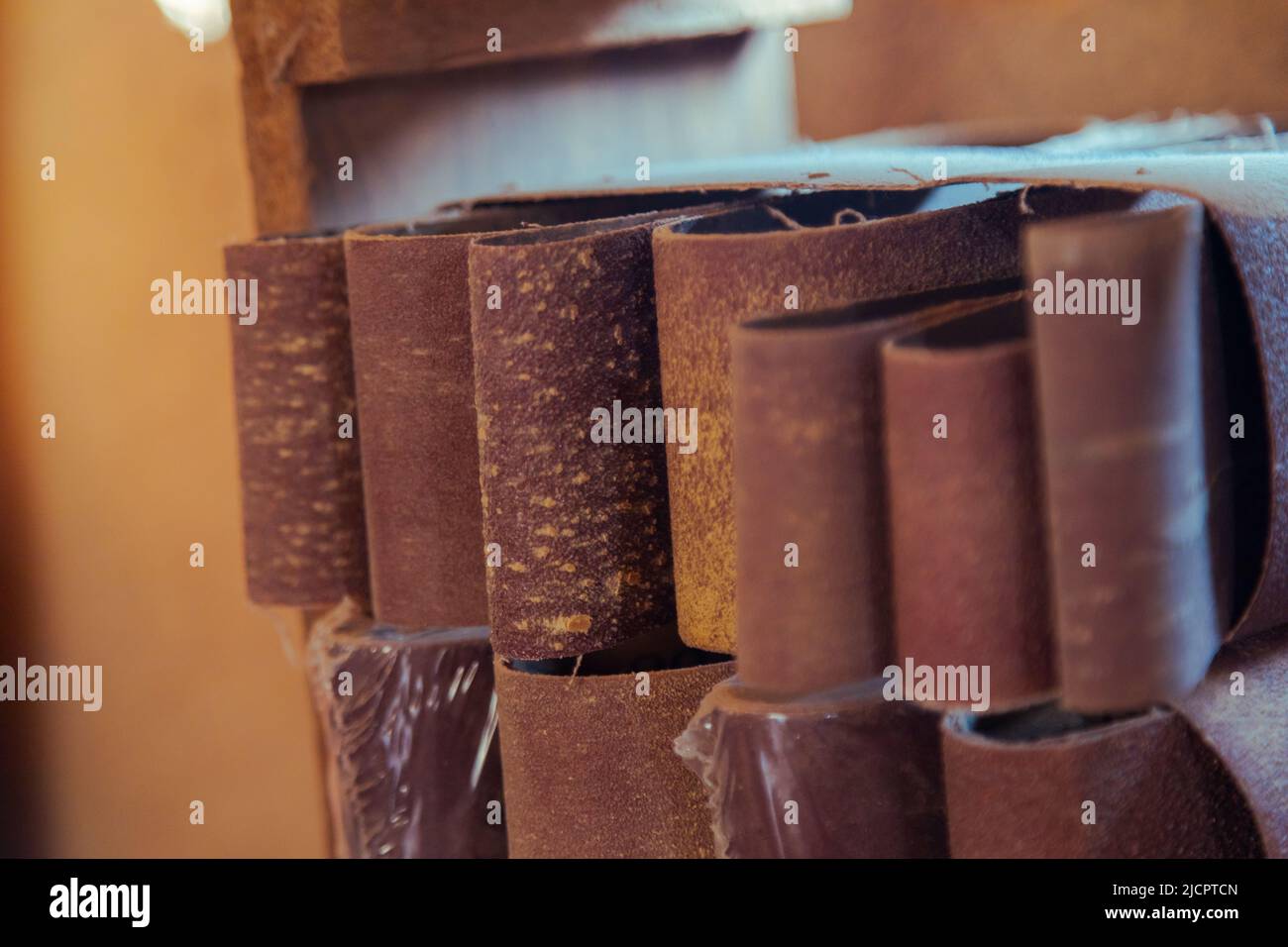 Closeup stack of sandpaper in carpentry workshop Stock Photo - Alamy