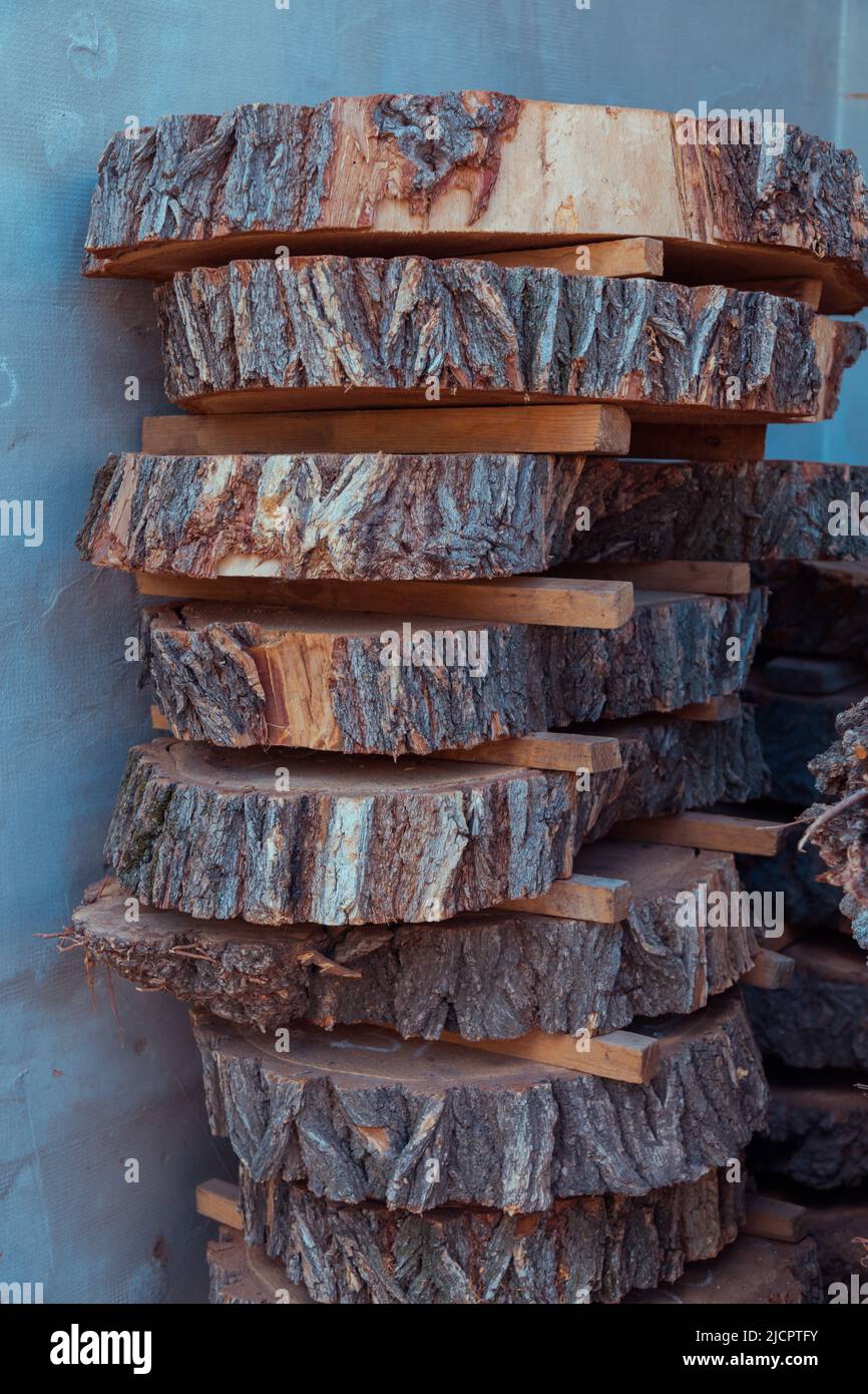 Stack of the wooden stumps lying on top of each other. Process of ...