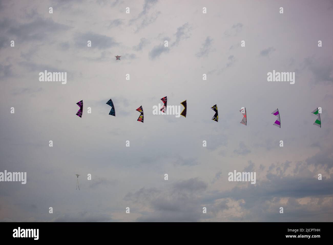 Nine individual kites follow each other in a perfect ballet Stock Photo ...