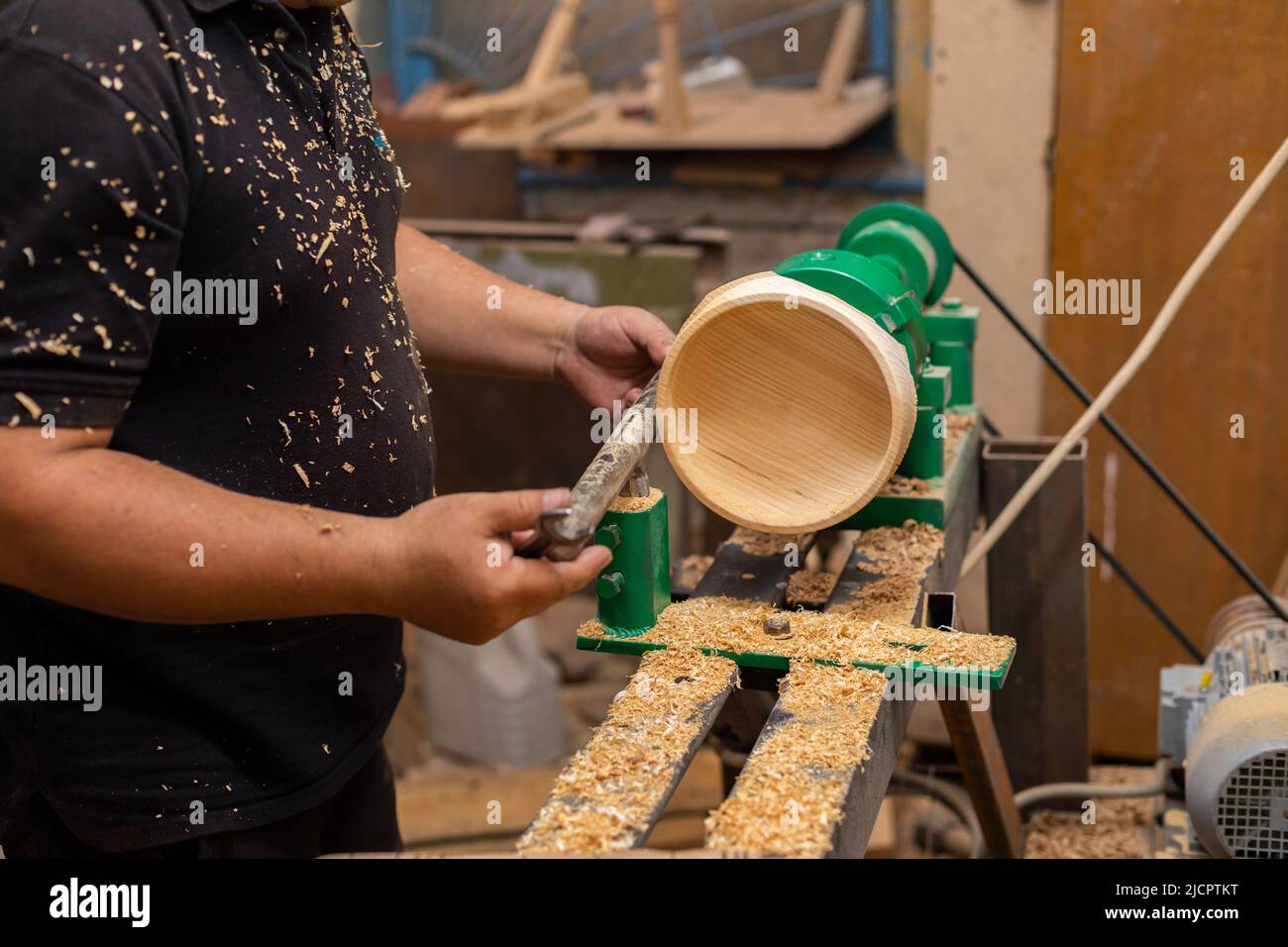 Carpenter preparing machine for turning wood on a lathe Stock Photo - Alamy