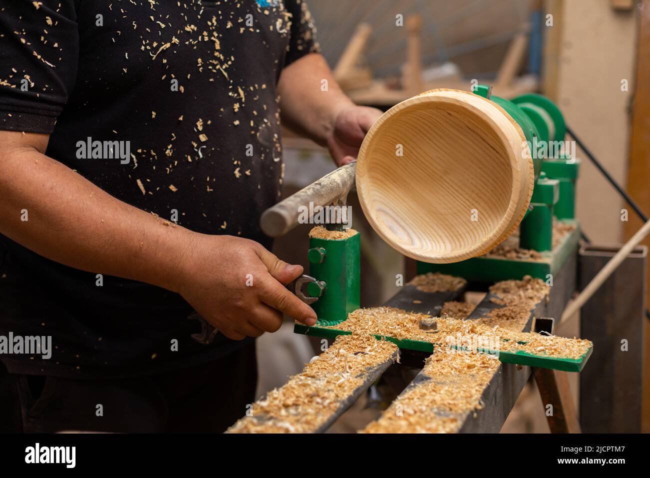 Carpenter preparing machine for turning wood on a lathe Stock Photo - Alamy