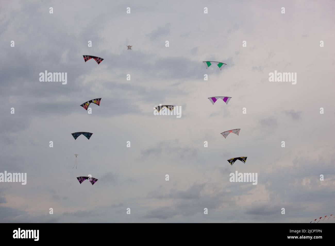 Nine individual kites follow each other in a perfect ballet Stock Photo ...