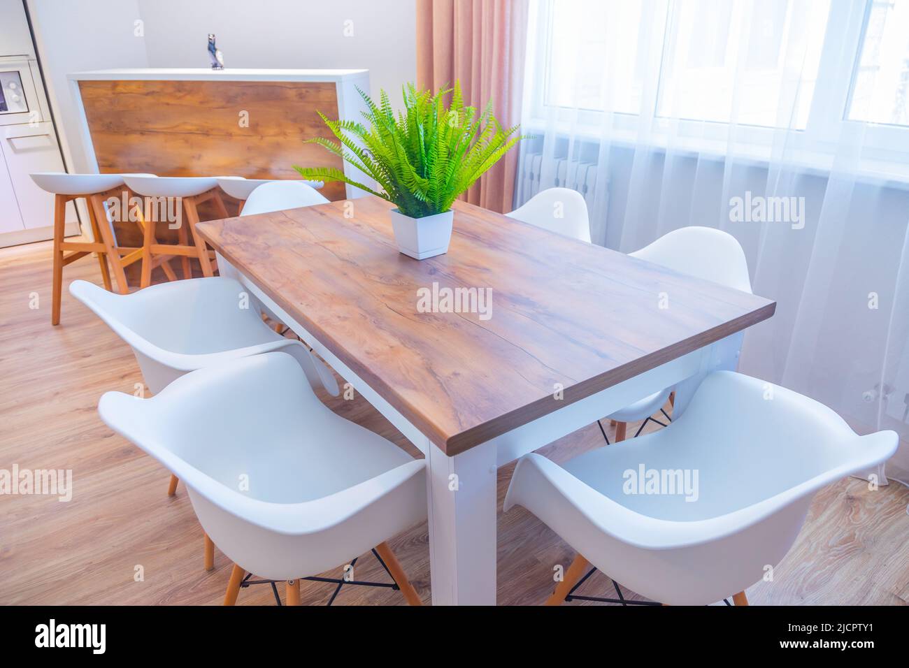 Wooden table with chairs. Modern interior design Stock Photo - Alamy