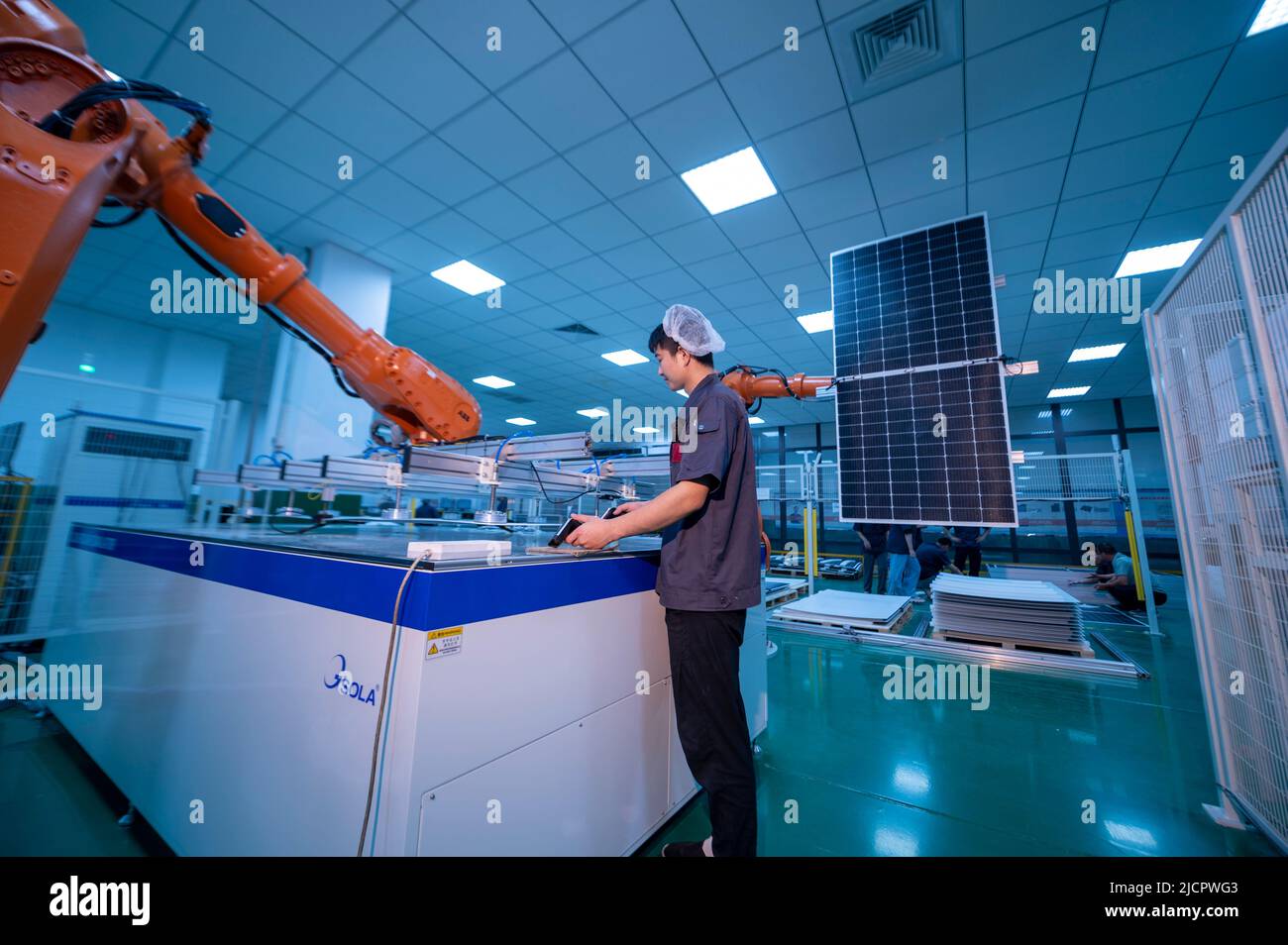 YANGZHONG, CHINA - JUNE 15, 2022 - A service member uses an industrial ...