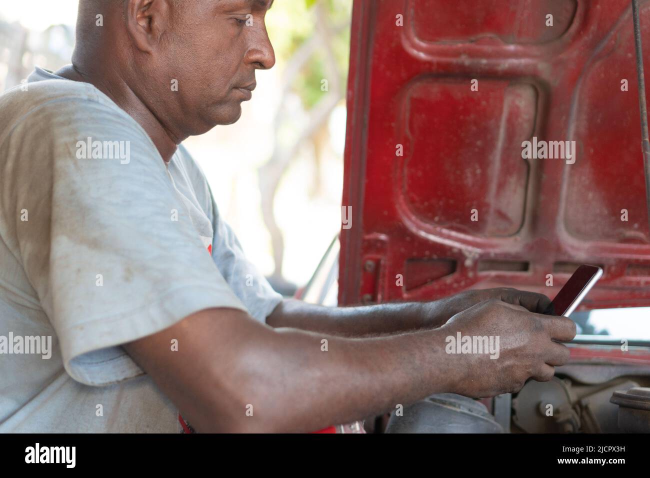 African man repairing car engine hi-res stock photography and images ...