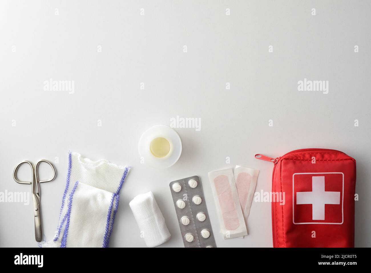 various medical objects for cures and first aid on white table. Top ...