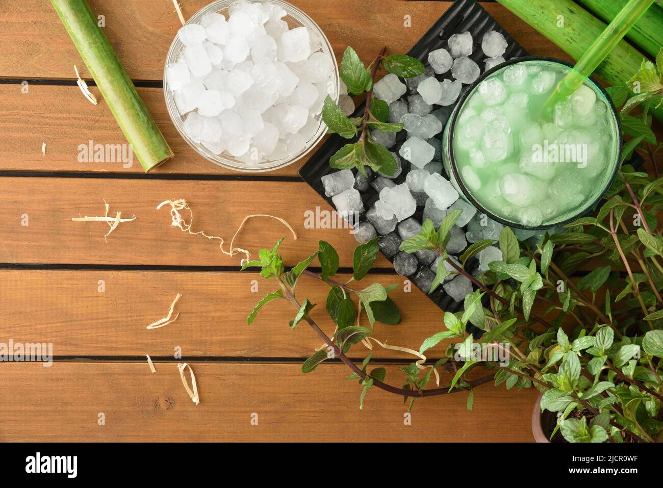 Natural iced mint on wooden table with crushed ice with leaves and ...
