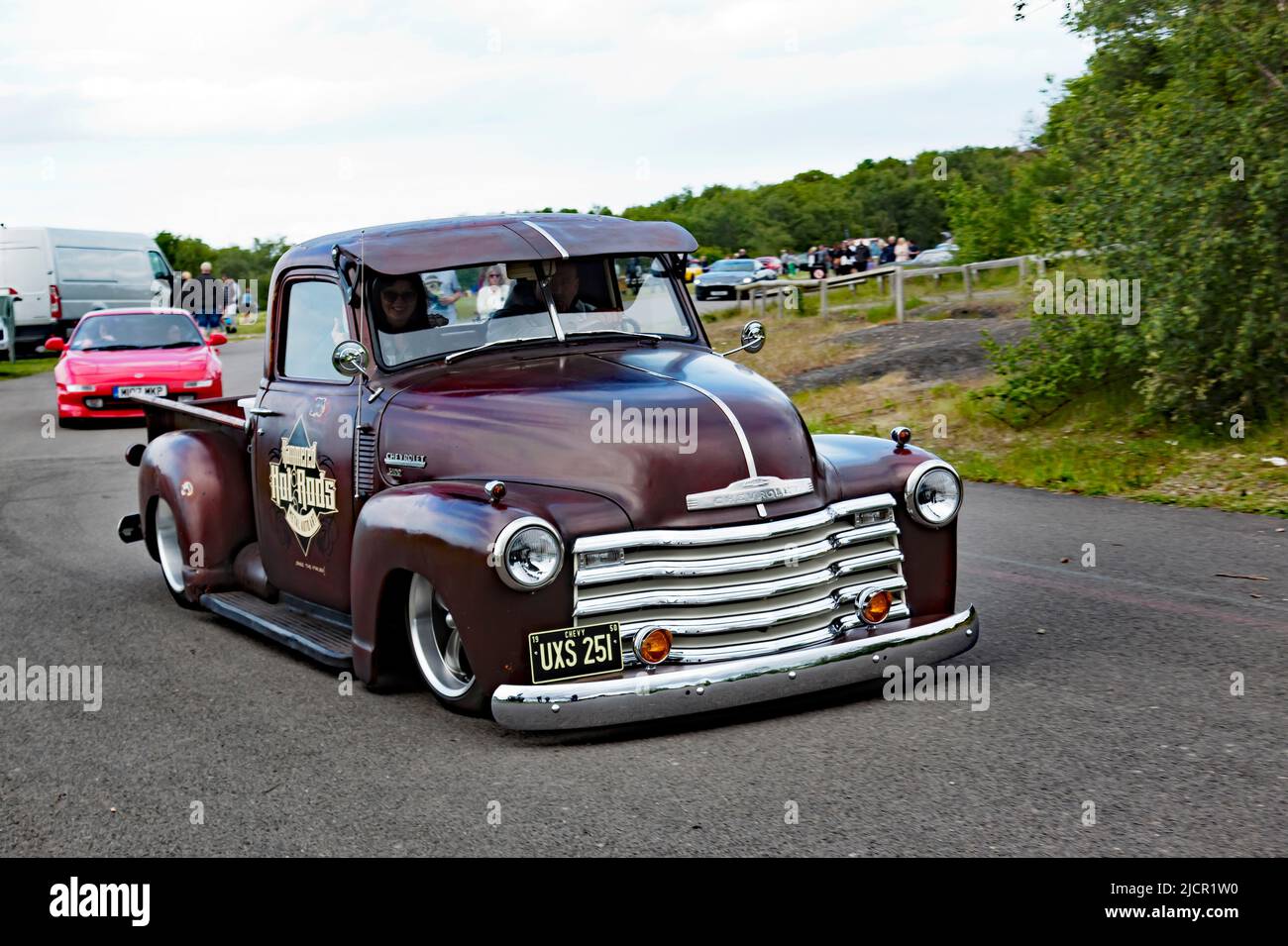 A Hot Rod Made From A Brown 1950 Chevrolet 3100 Truck On Display At