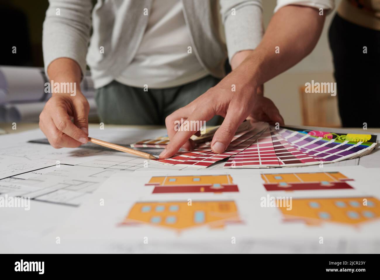 Close-up image of engineer and interior designer discussing color ...