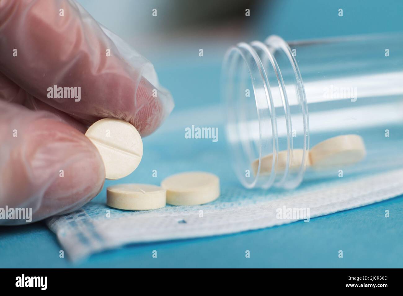 medical tablets close on the blue background. Coronavirus, flu ...