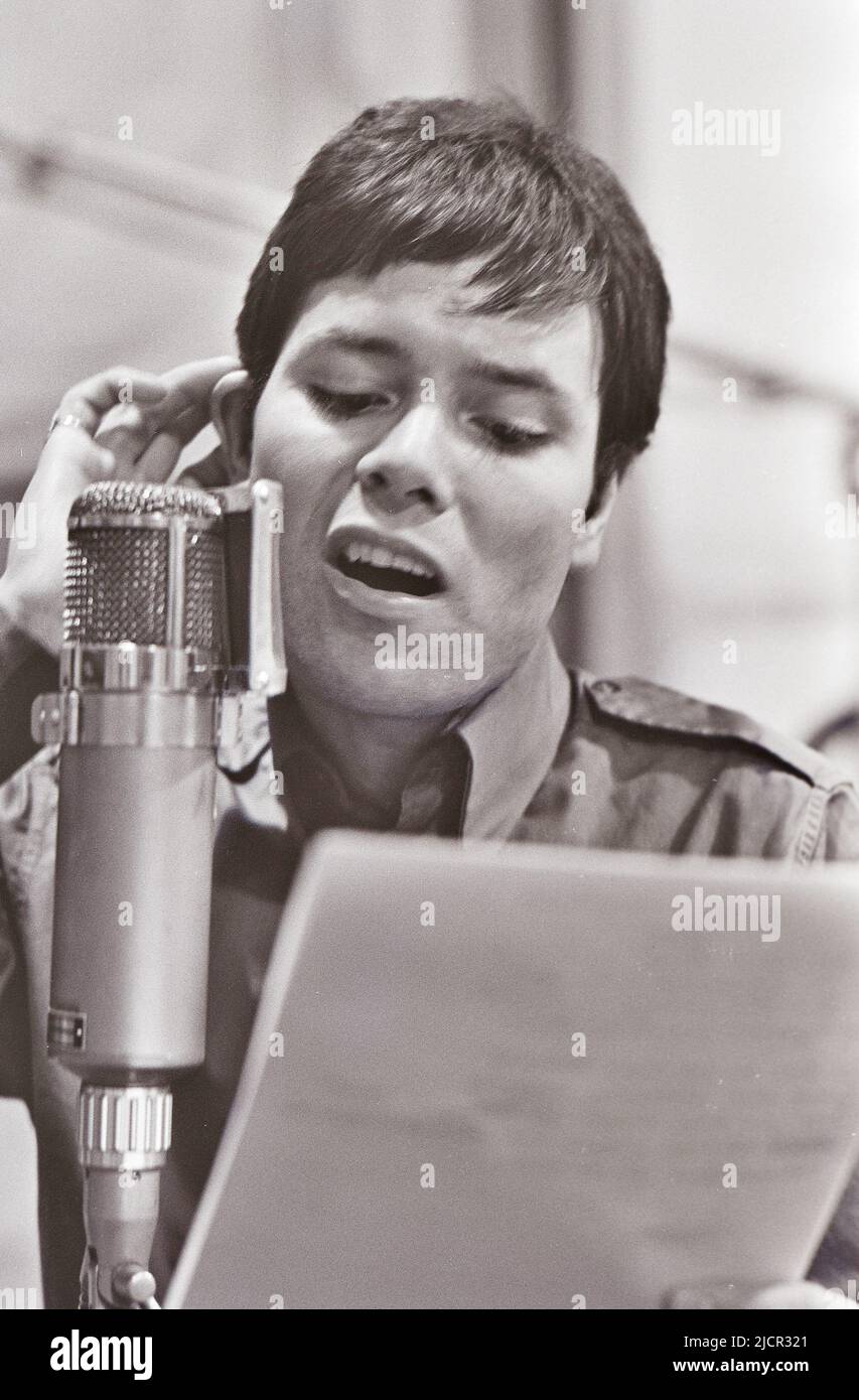 CLIFF RICHARD UK pop singer and film actor recording in May 1966. Photo ...