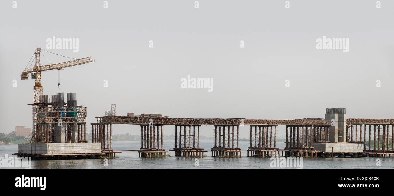 Bridge construction on the river Nile showing scaffolding and concrete ...