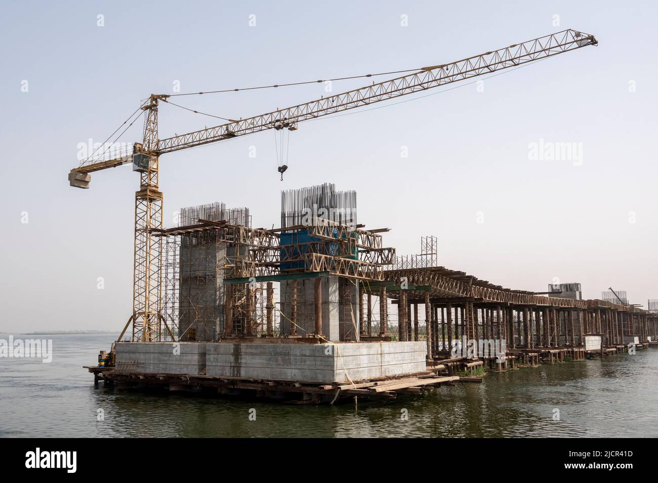 Bridge construction on the river Nile showing scaffolding and concrete ...
