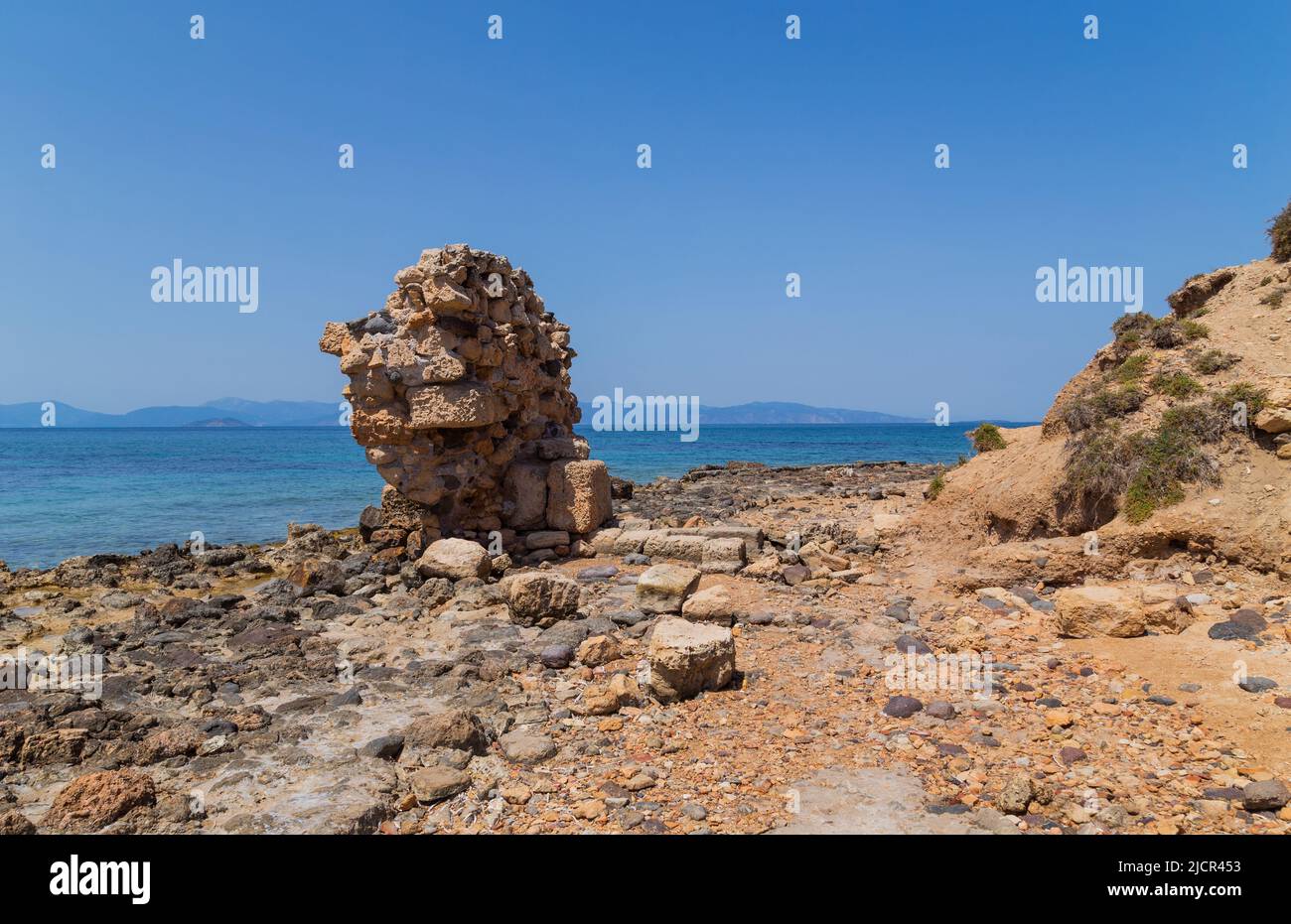 The coast of Aegina island with clear and blue waters of Mediterranean ...